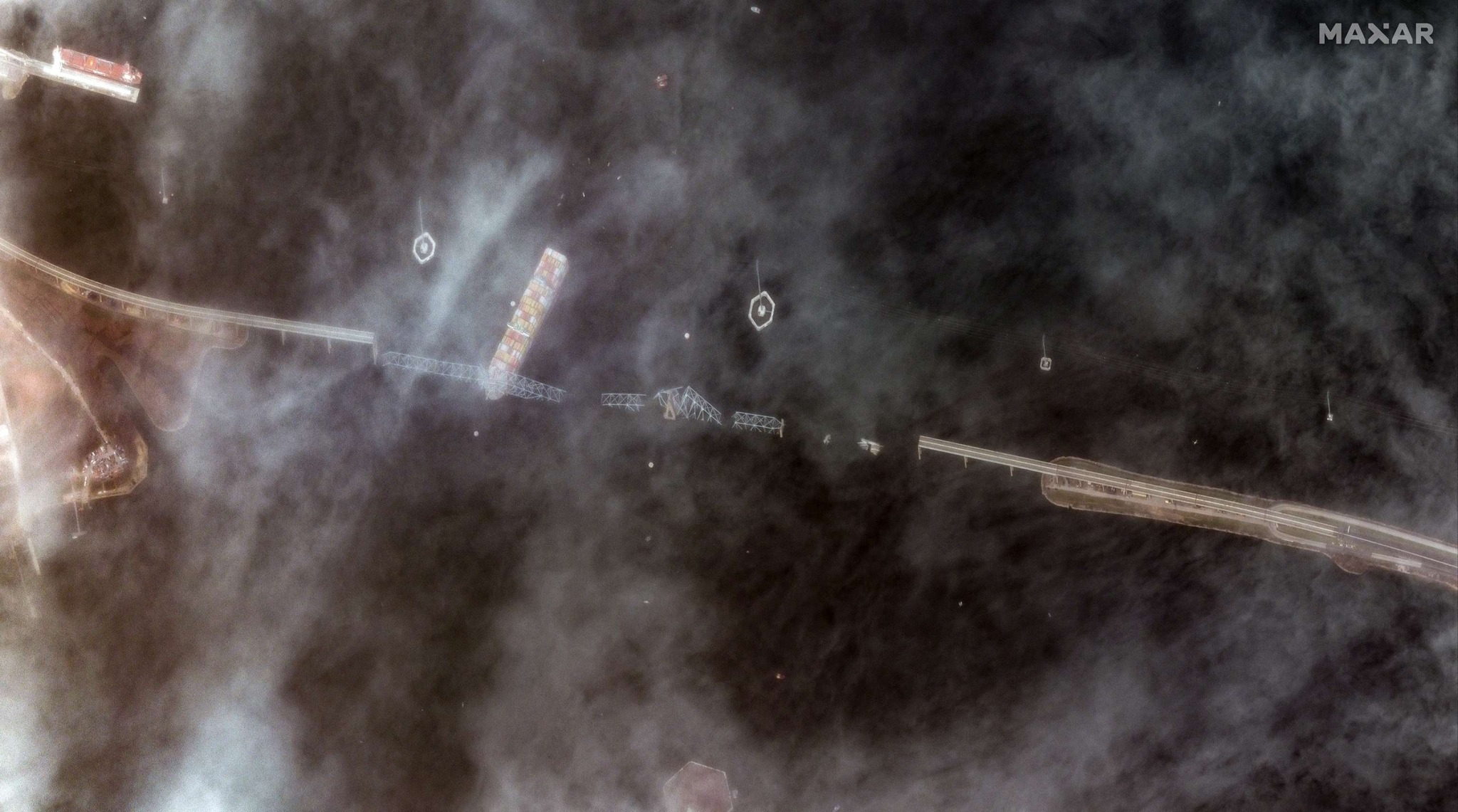 Satellite images capture Baltimore bridge collapse