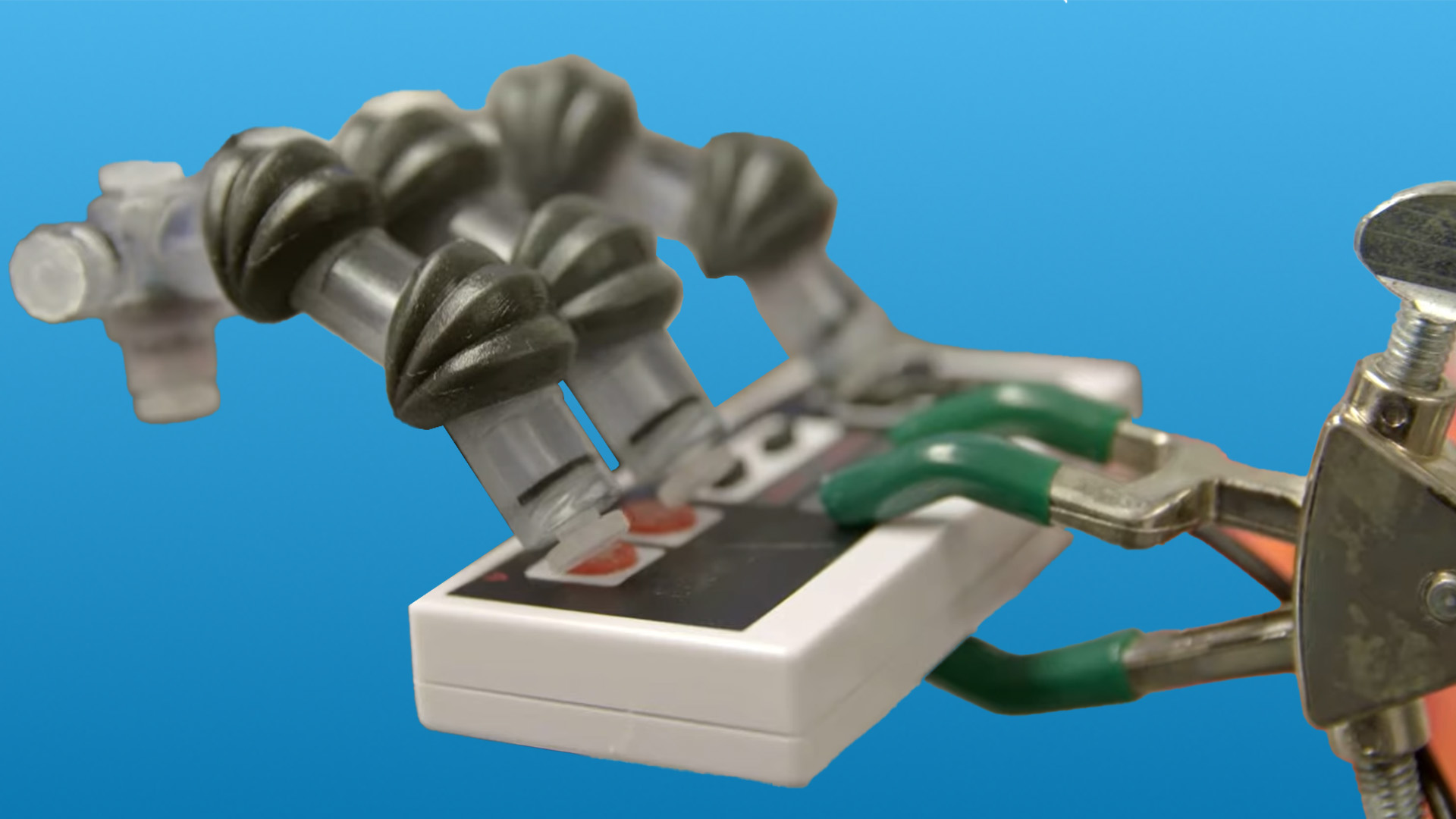 Robot hand plays Mario